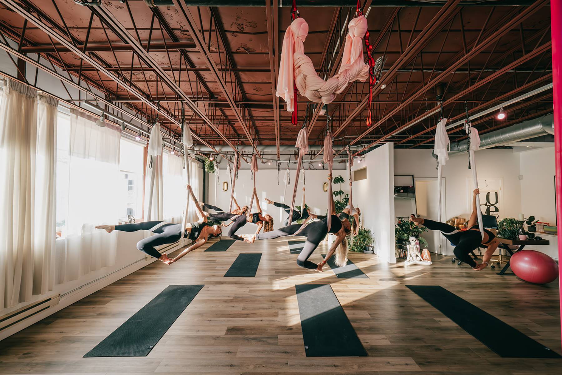 How Aerial Yoga in Toronto Transforms Your Routine - AT OM Yoga + Pilates